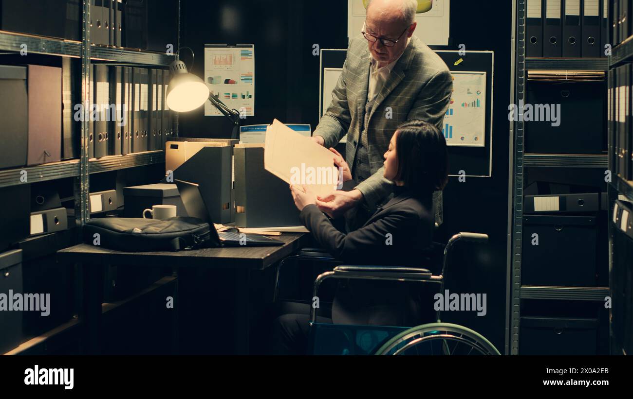 Team detectives analyzing surveillance records hi-res stock photography ...