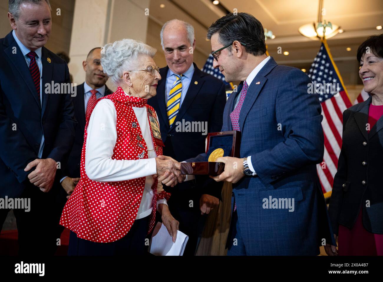 Mae Krier, an award recipient and a “Rosie”, accepts the Congressional ...