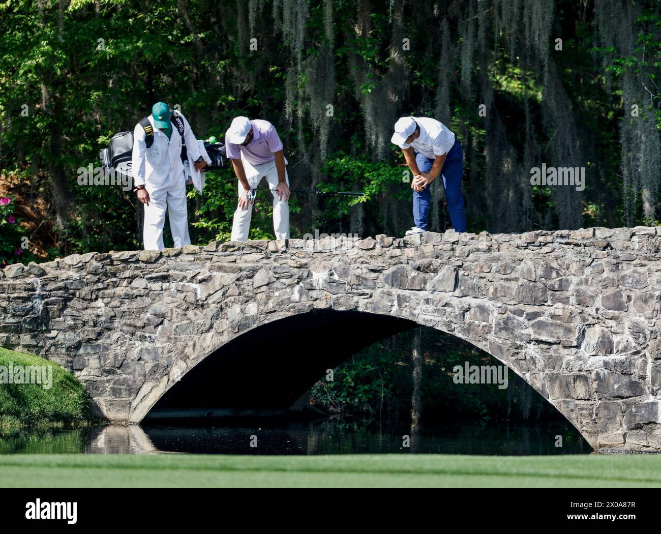 Augusta, United States. 10th Apr, 2024. Tom Kim of South Korea (R) and ...