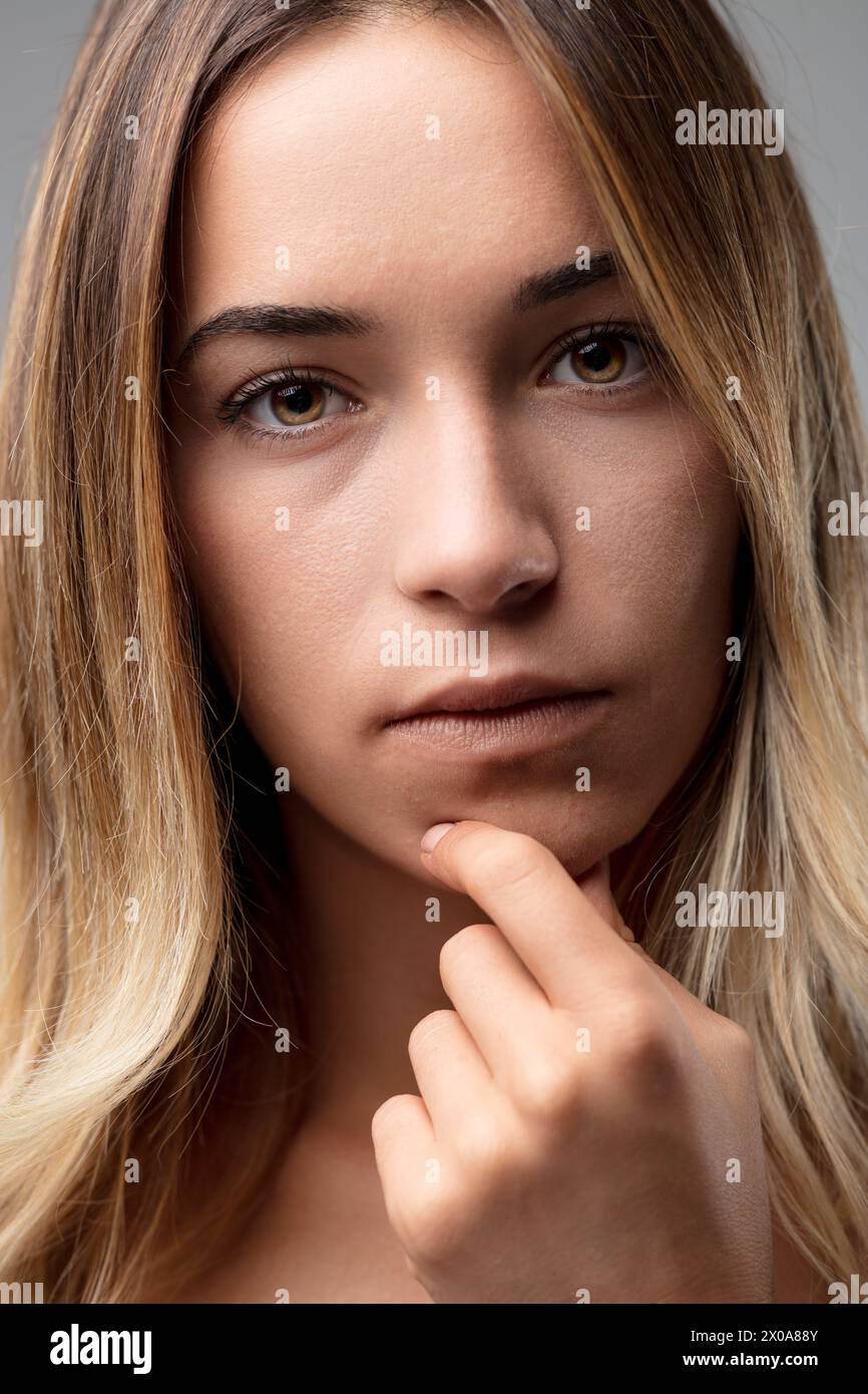 The close-up of a woman reveals subtle confidence, her delicate lace ...