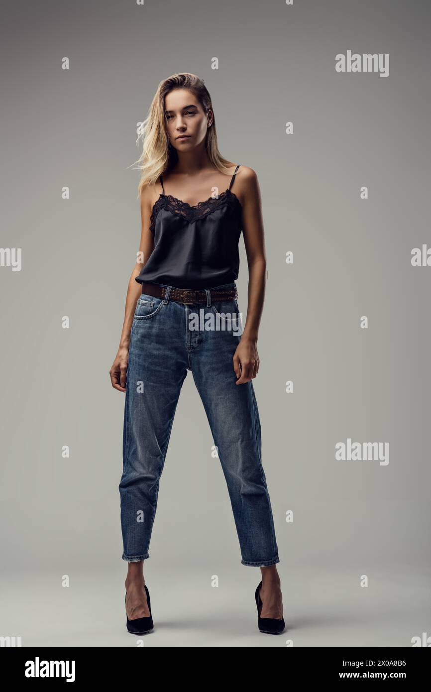 Elegance in simplicity, the image shows her dressed in a black lace top ...