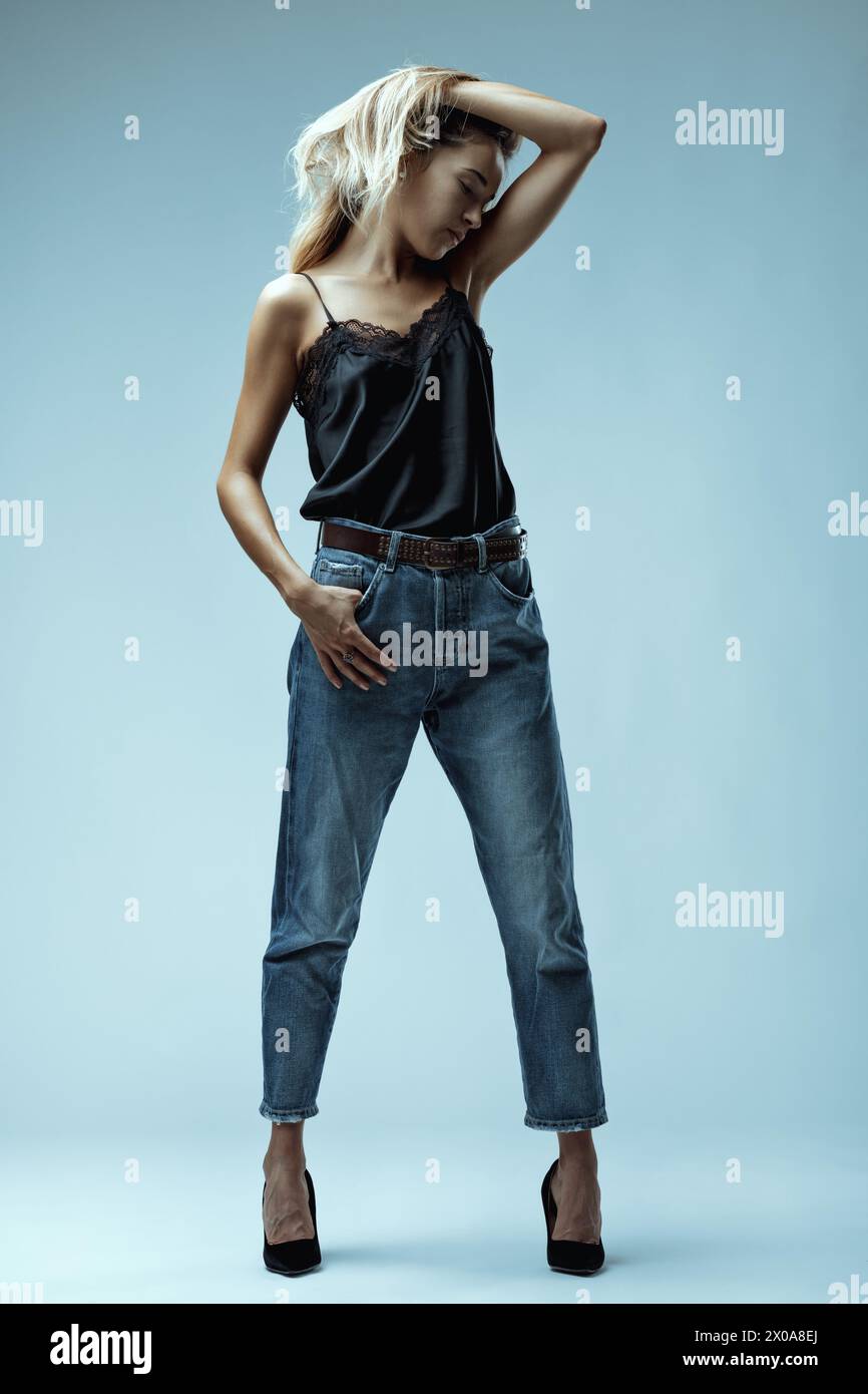 image captures a woman’s relaxed moment, her pose spontaneous, as the ...