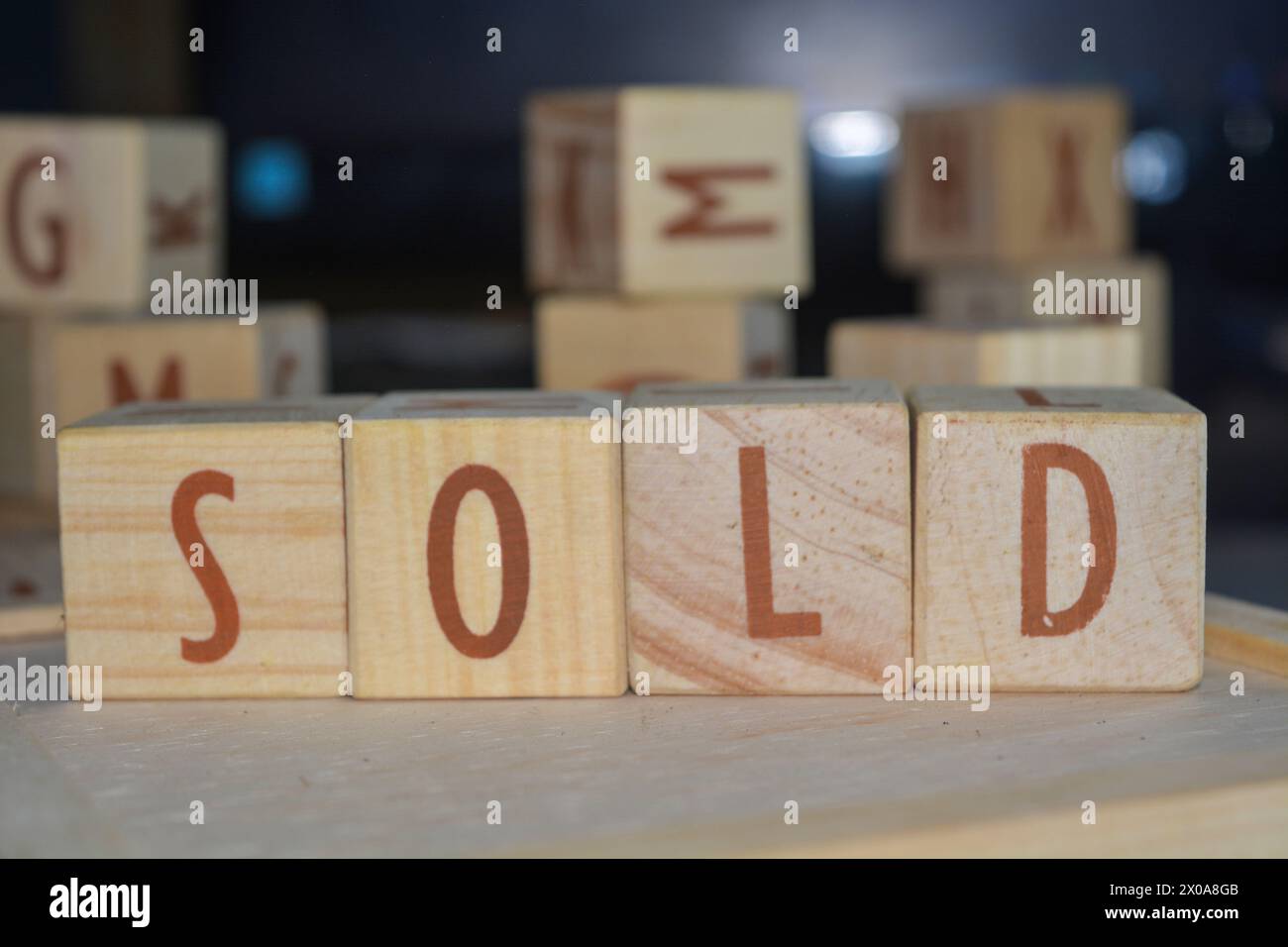 Wooden alphabet blocks isolated on white with sentence "SOLD Stock ...