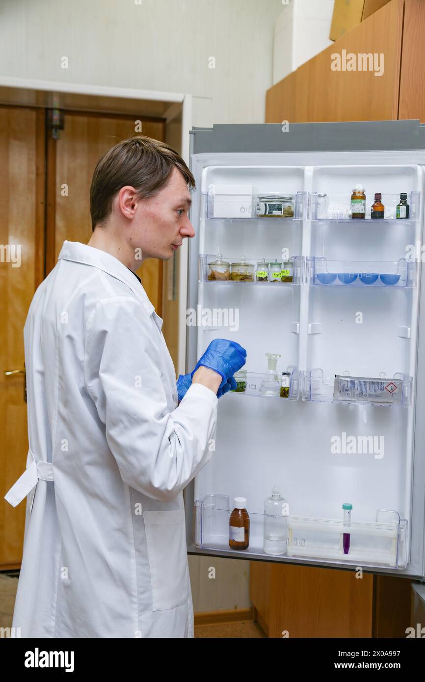 Scientist taking sample from tube hi-res stock photography and images ...