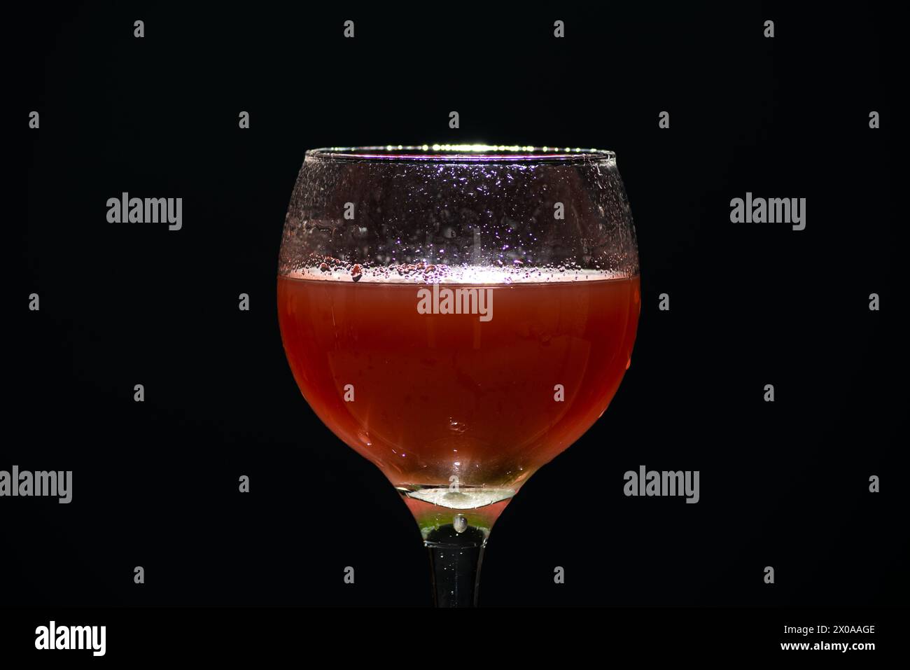 A glass cup with guava juice inside Stock Photo - Alamy