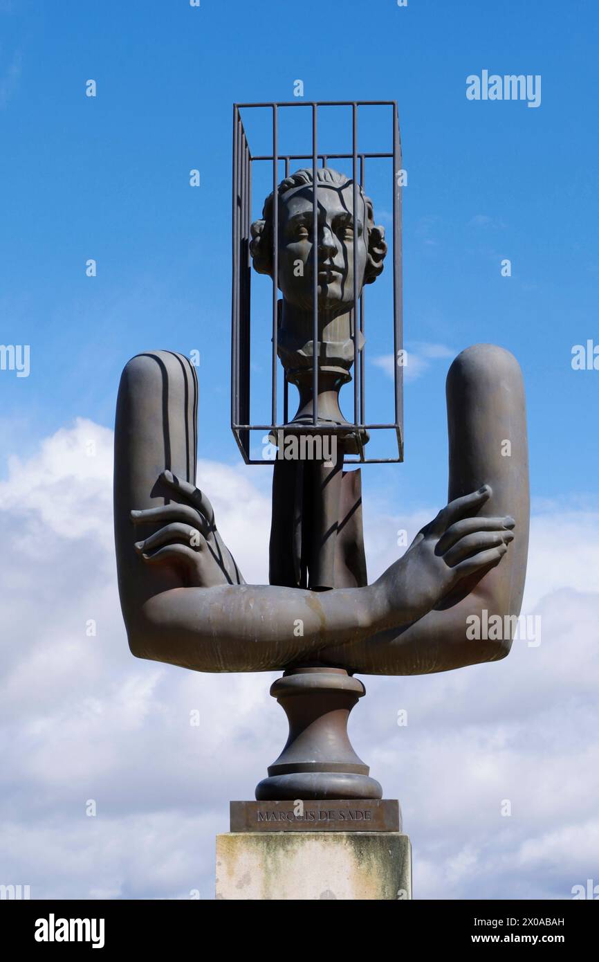 Metal sculpture depicting Marquis de Sade with crossed arms, created by ...