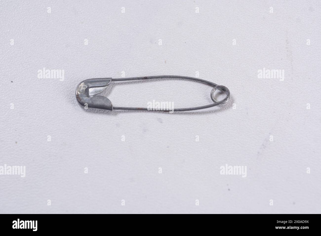 Close up isolated hijab safety pin on white background Stock Photo - Alamy