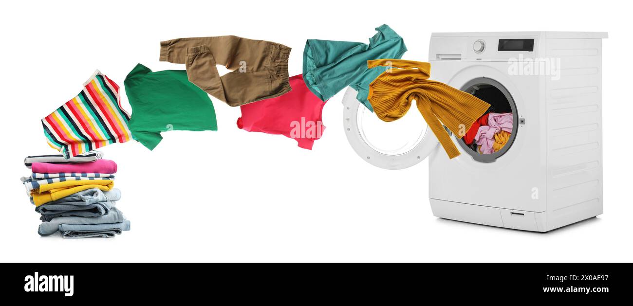 Washing machine and flying clothes on white background Stock Photo - Alamy