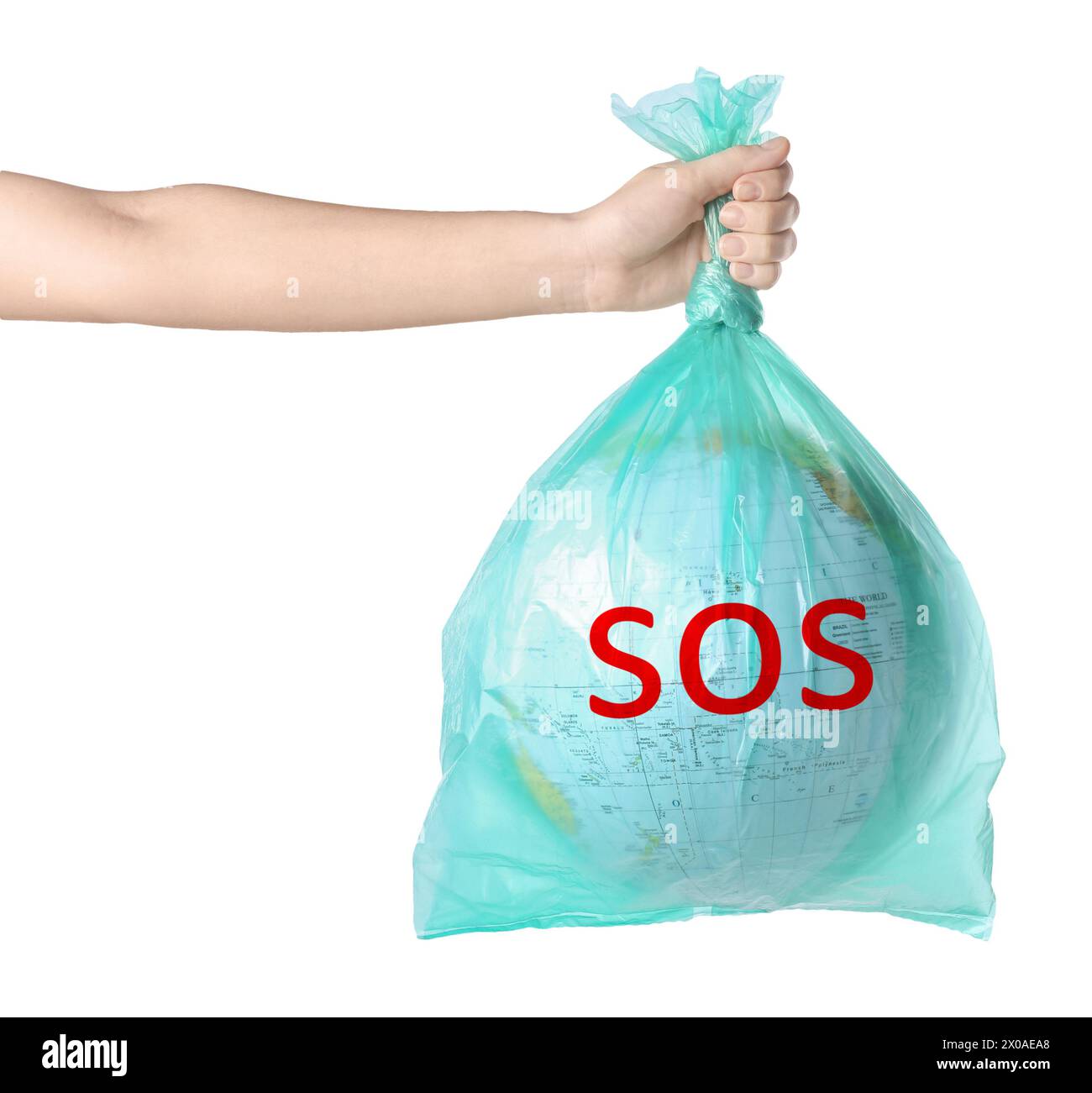 Woman holding globe with word SOS in plastic bag on white background ...