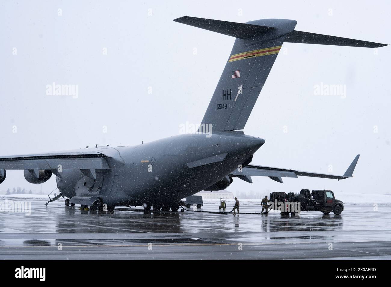 Airmen with the 673rd Logistics Readiness Squadron refuel a C-17 ...