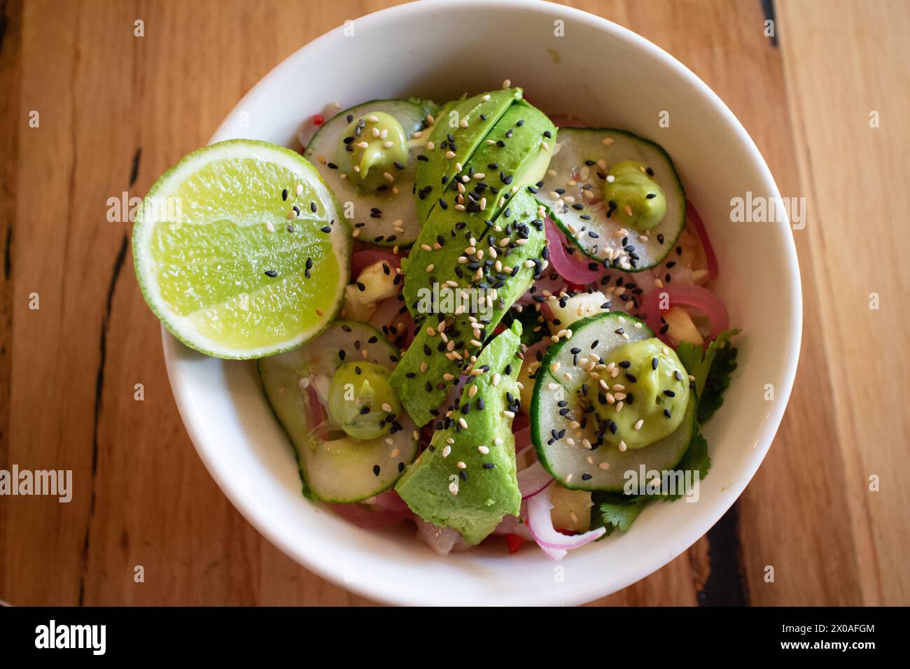 Avocado and Radish Poke Bowl Stock Photo - Alamy