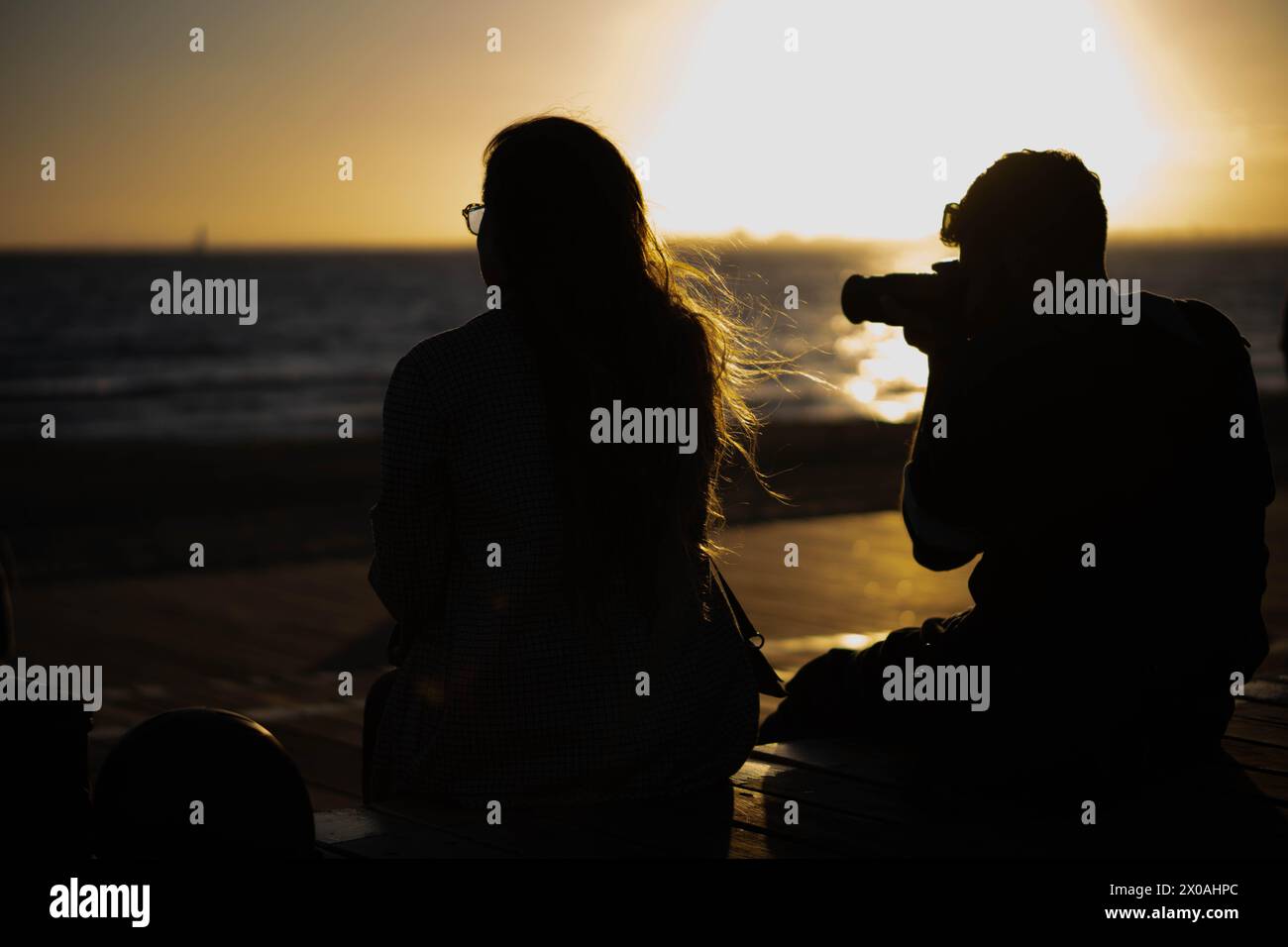 Sunset hunting at st kilda beach Stock Photo - Alamy