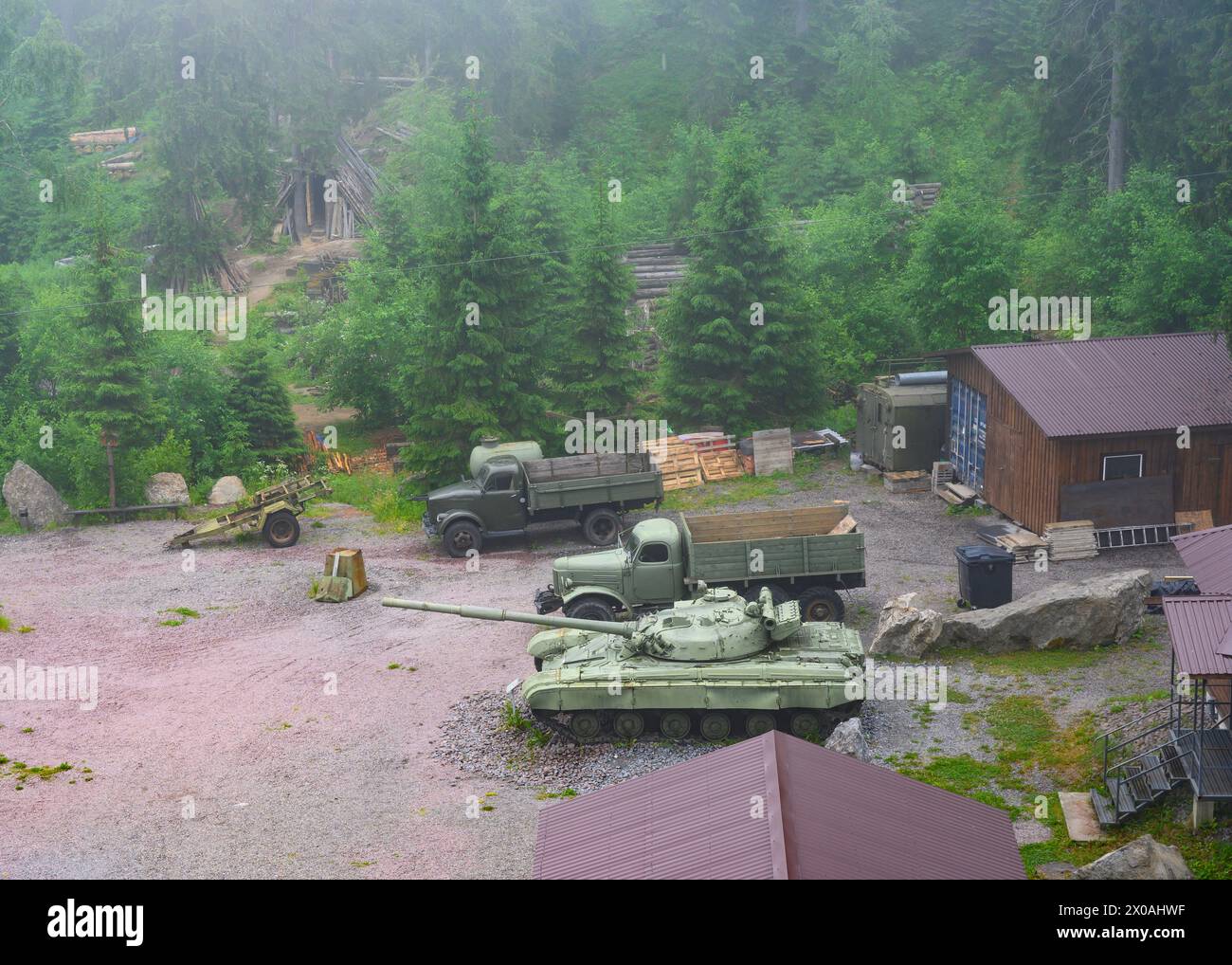 Military vehicles and a tank of the USSR army near buildings in the ...