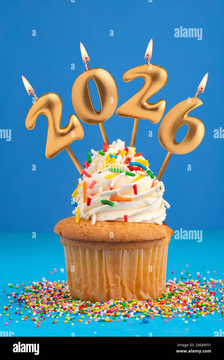 Happy New Year 2026 - Candles in the form of burning numbers on a blue ...