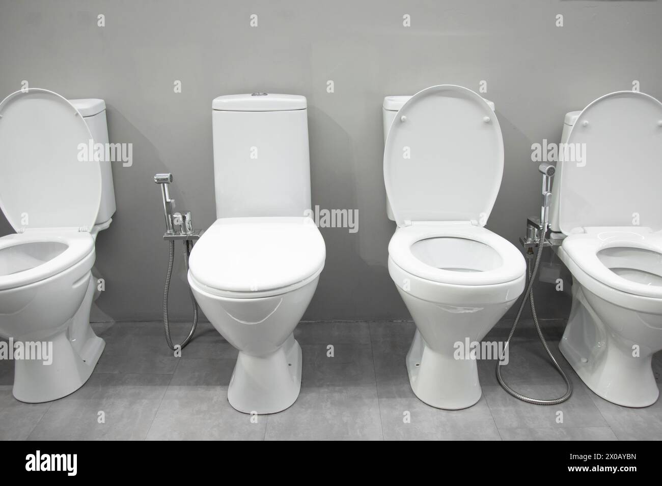 New modern toilet in the plumbing store. Samples of modern sanitary ...