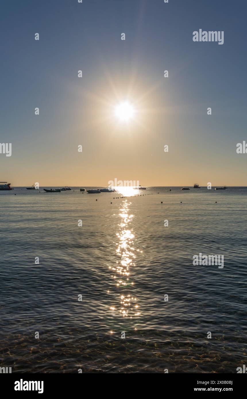 Sunrise over the sea. Panoramic seascape. Burning sky and shining ...