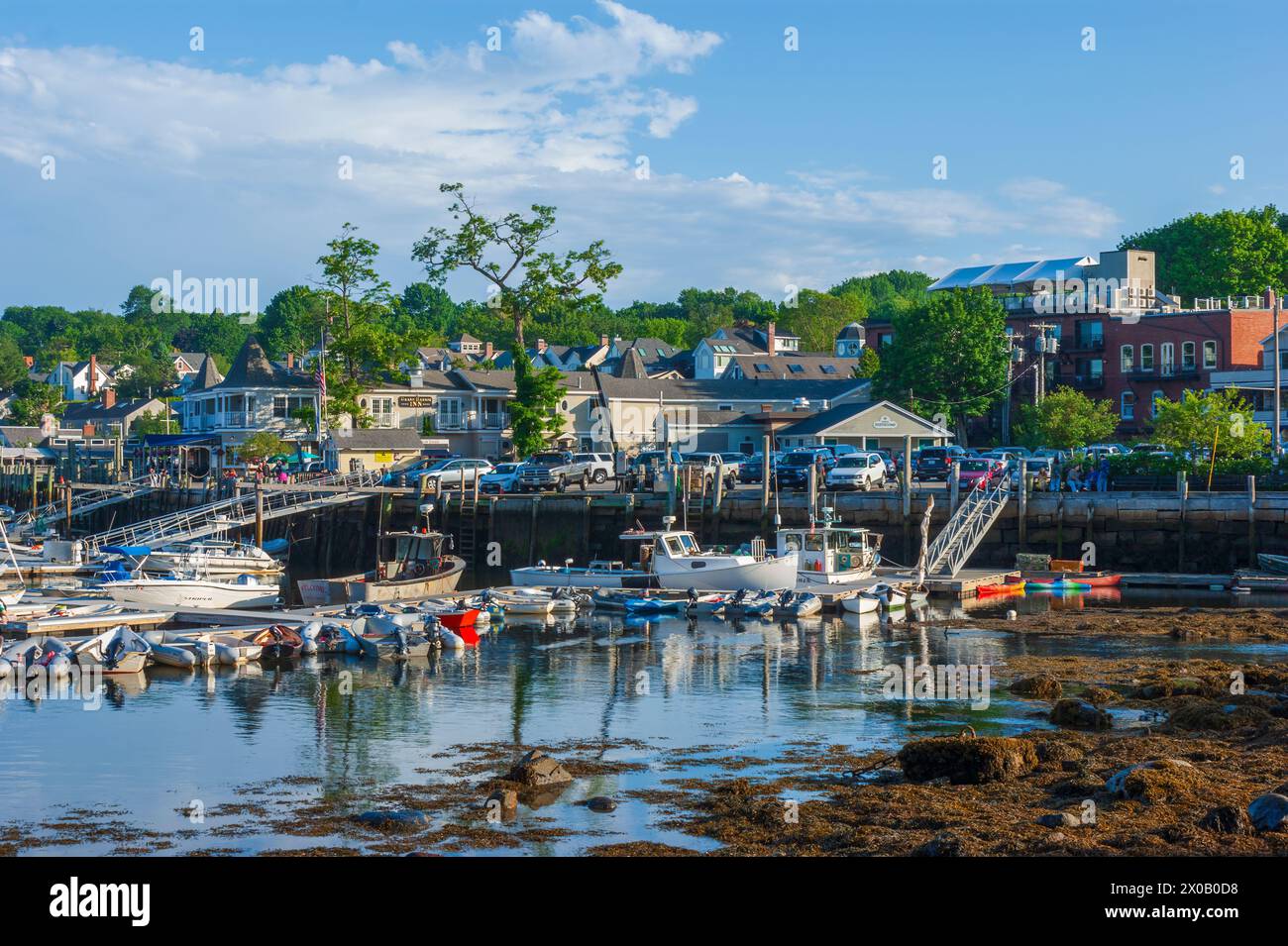 Fishing boats and dinghies docked along the waterfront in Camden Harbor ...