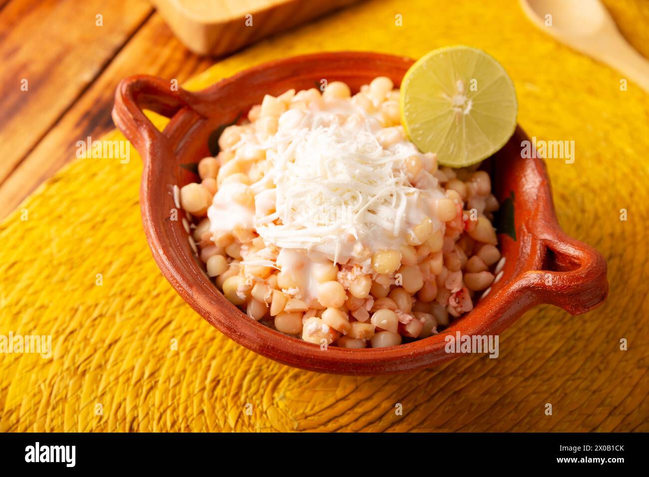 Esquites. Corn kernels cooked and served with mayo, sour cream, lemon ...