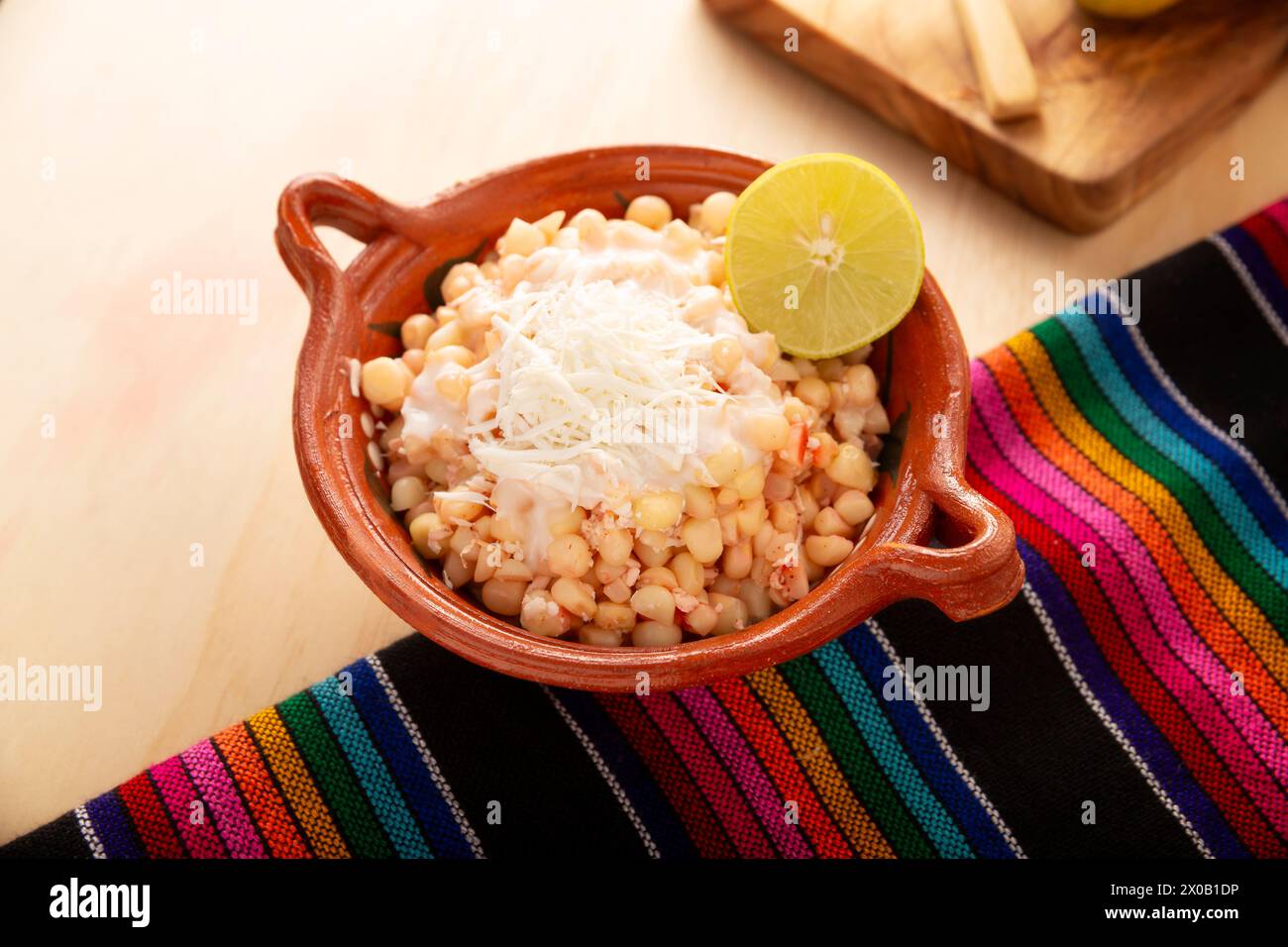 Esquites. Corn kernels cooked and served with mayo, sour cream, lemon ...