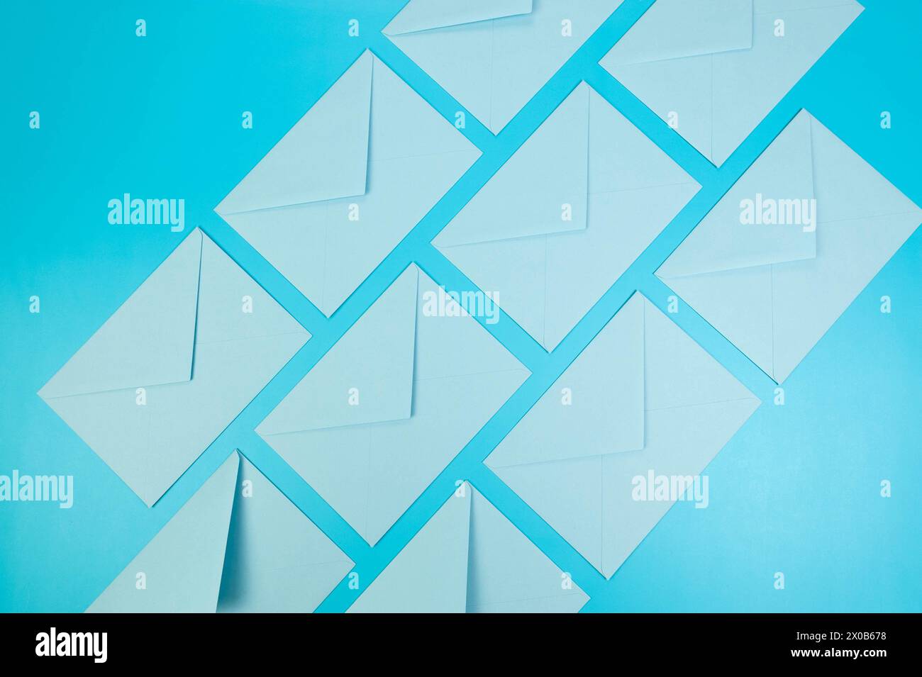 Top view of light blue envelopes on blue background. Post flat lay ...