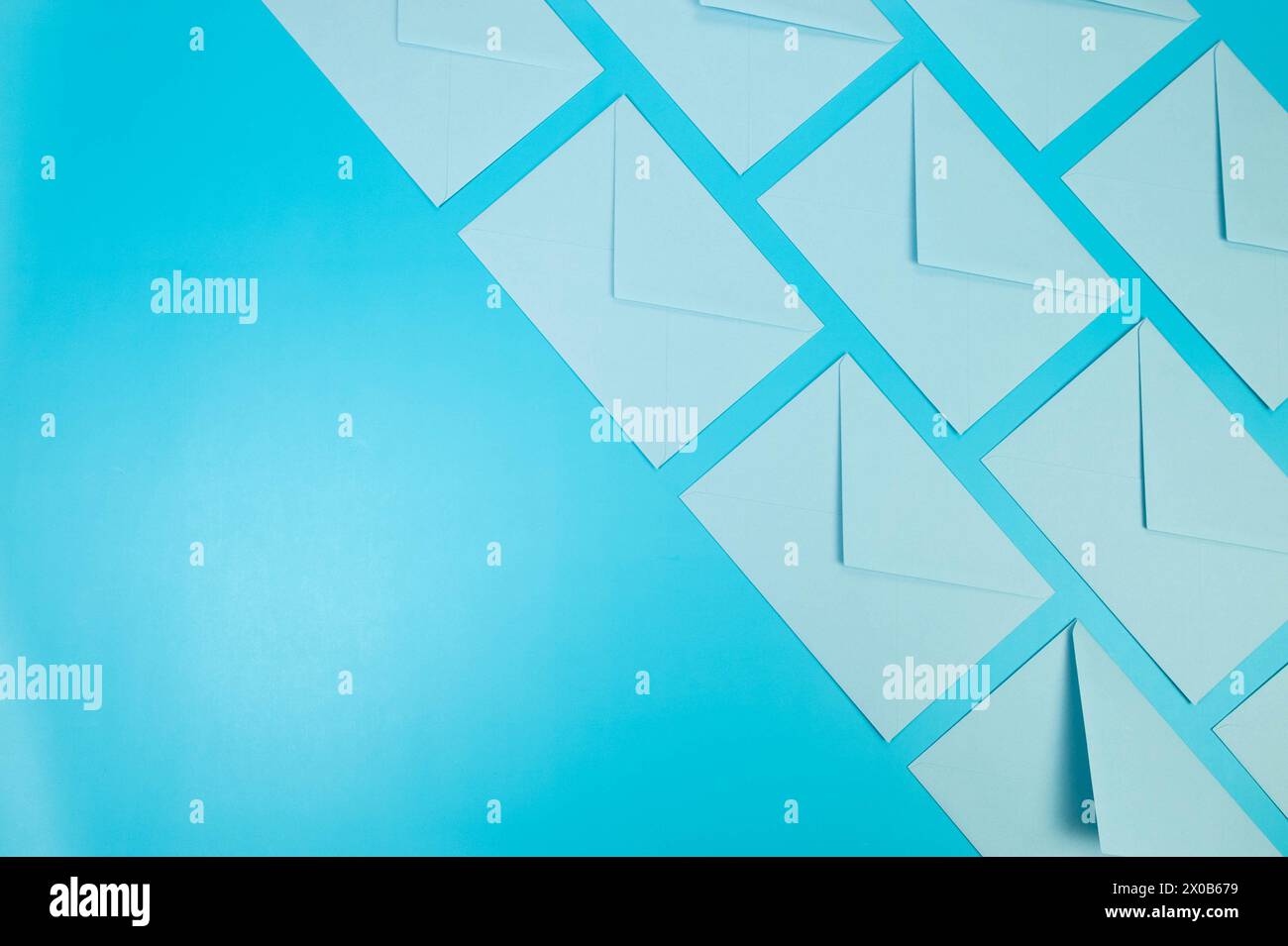 Top view of light blue envelopes on blue background. Post flat lay ...