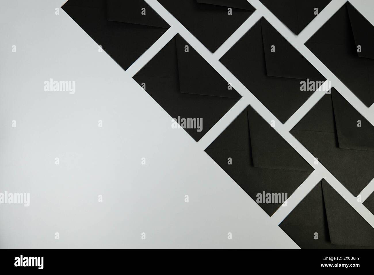Top view of black envelopes on grey background. Post flat lay. Copy ...