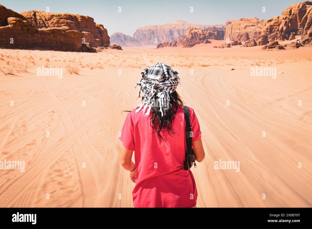 Back view female tourist stand curious watch wadi rum landscape ...