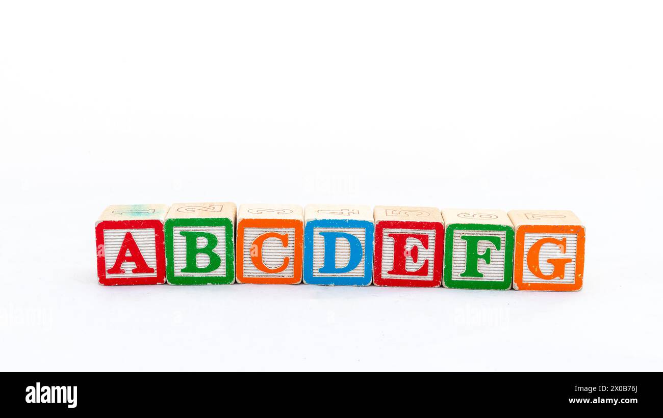 ABCDEFG wooden letter blocks isolated on white background Stock Photo ...