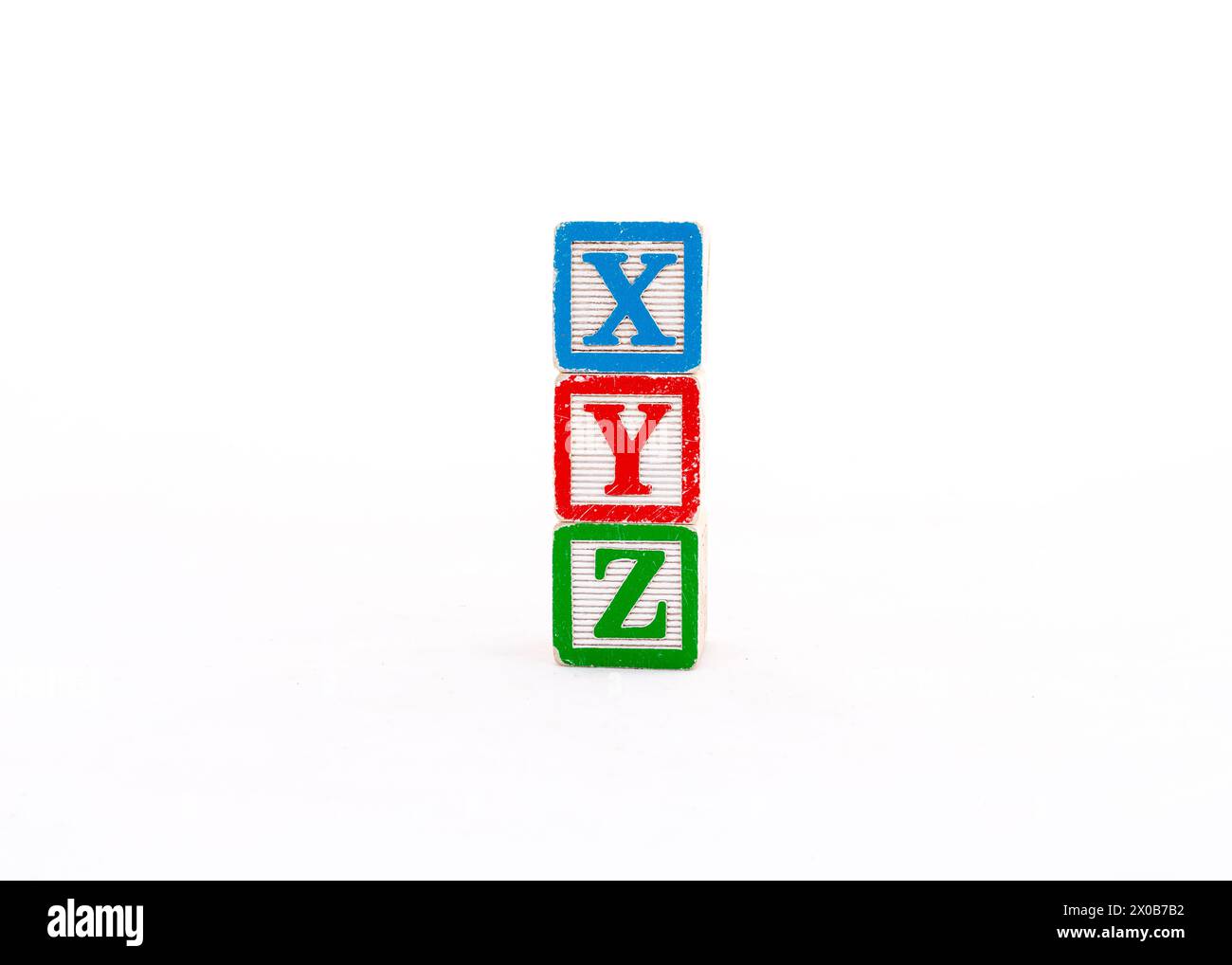 XYZ alphabets letters written on wooden cubes isolated on white ...