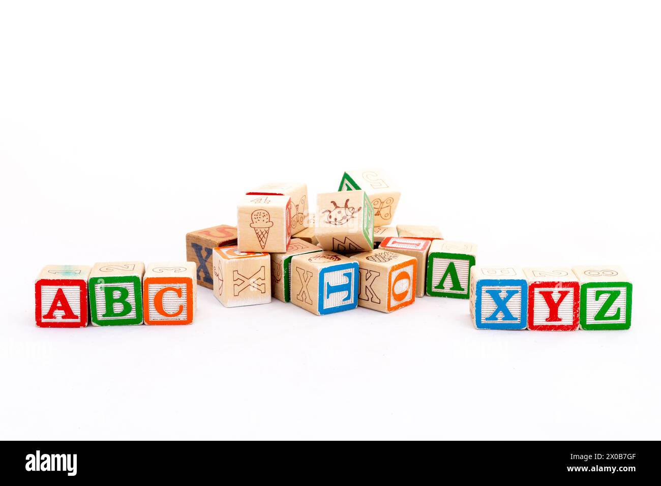 Alphabets cubes scattered on white background with a selective focused ...