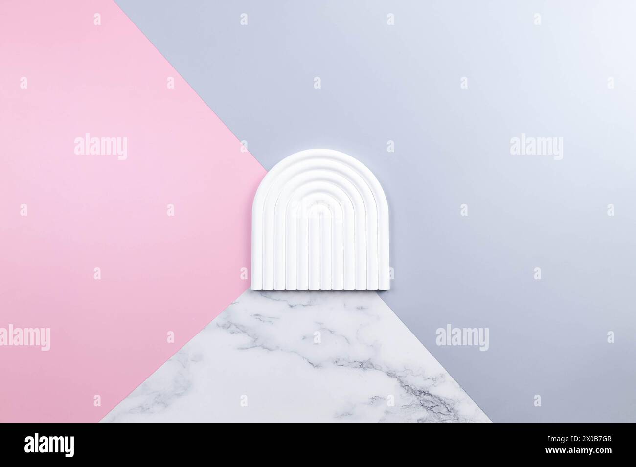 Top view of white arch tray on colourful background. Blue, pink and ...