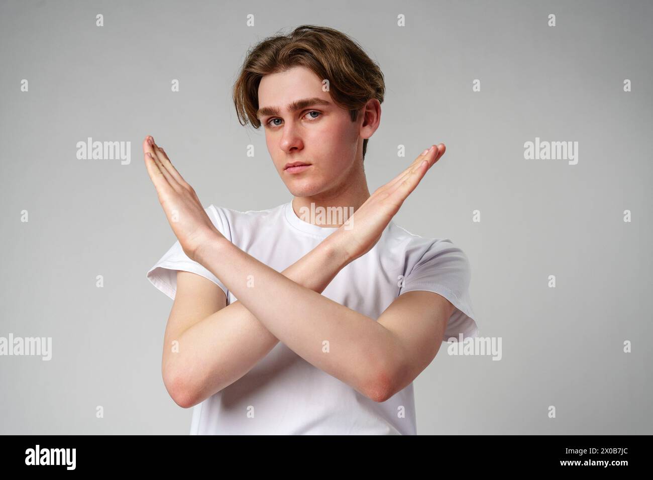 Man making x with arms hi-res stock photography and images - Alamy