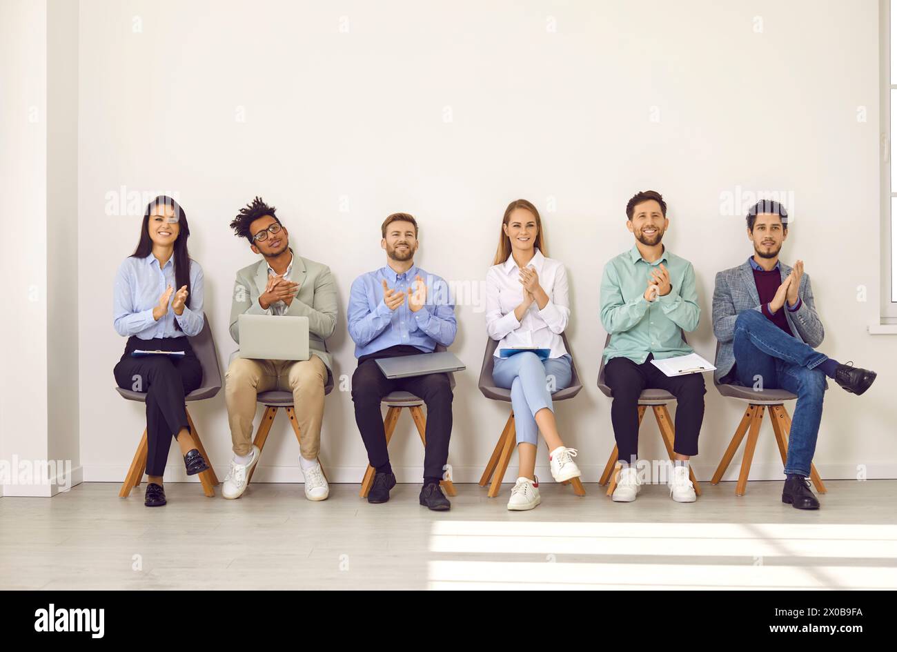 Group of young diverse people clapping hands at a professional business conference Stock Photo ...