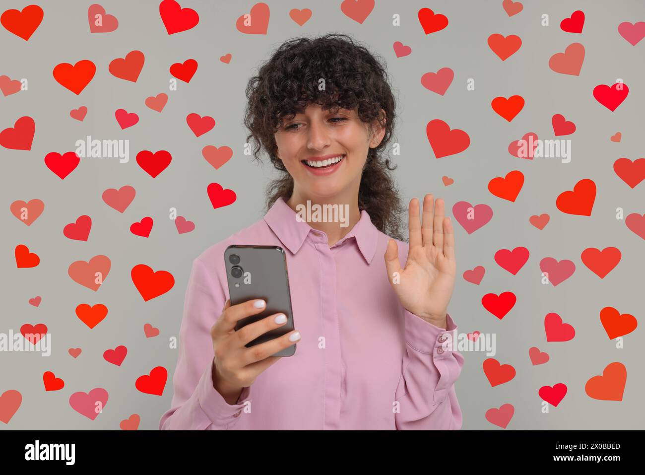 Long distance love. Woman video chatting with sweetheart via smartphone ...