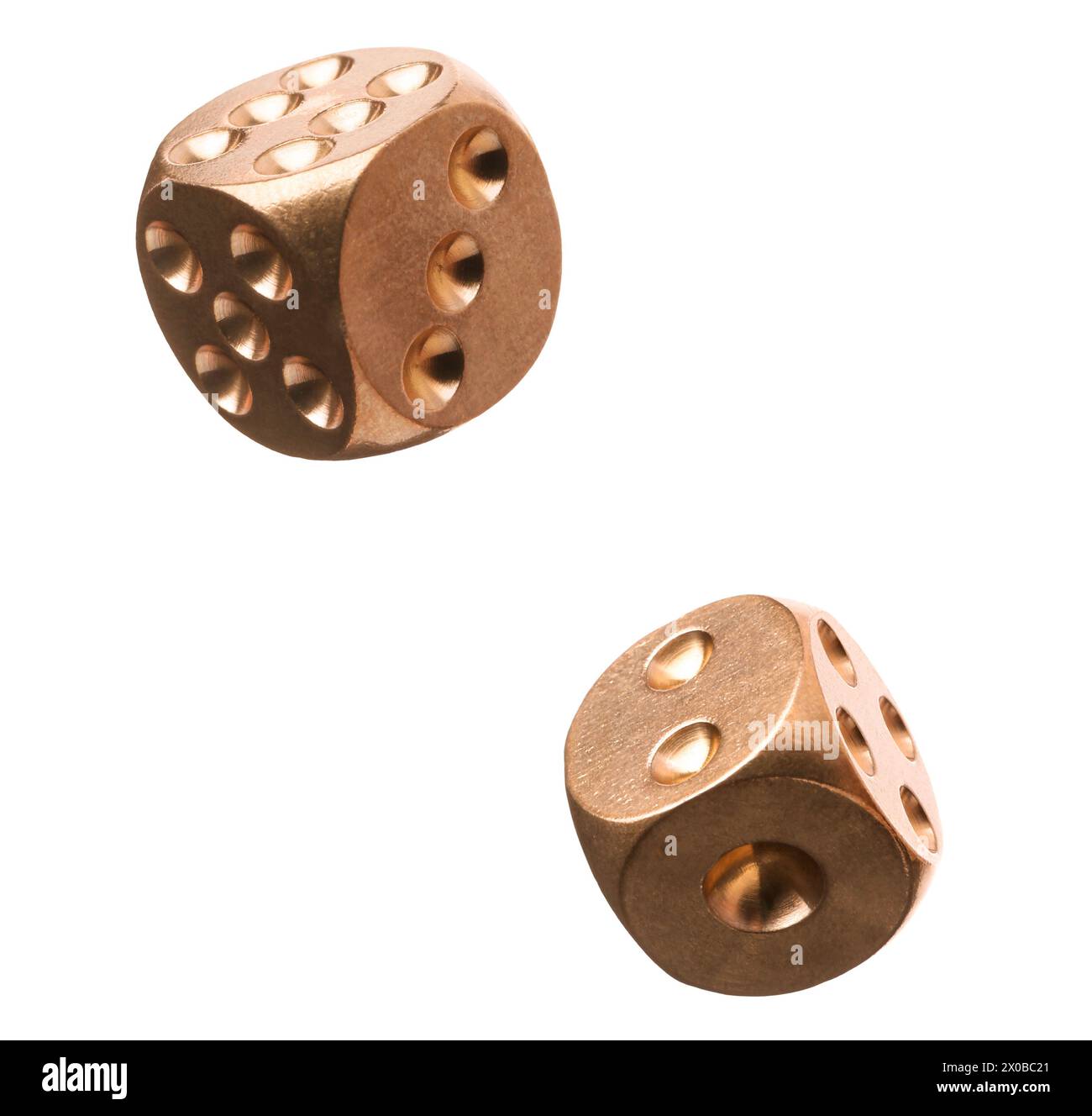 Two golden dice in air on white background Stock Photo - Alamy