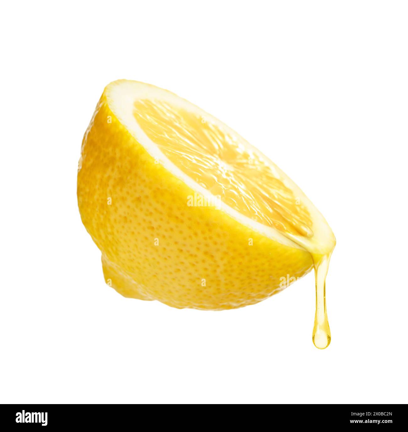 Juice dripping from half of lemon isolated on white Stock Photo - Alamy