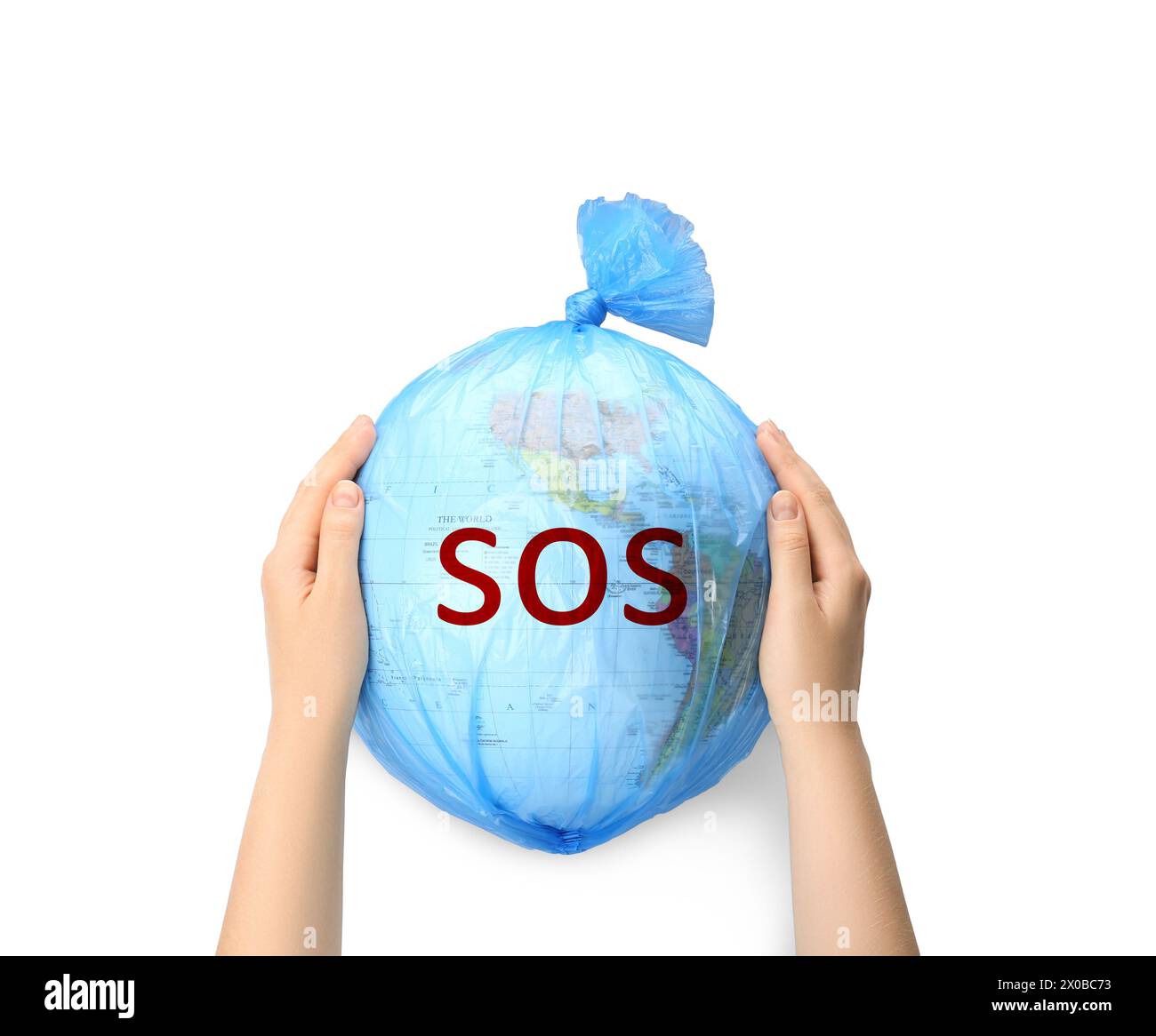 Woman holding globe with word SOS in plastic bag on white background ...