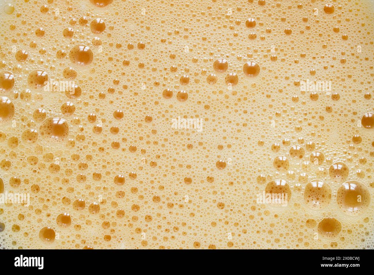 A texture of whipped egg foam, captured in a close-up view filled with ...