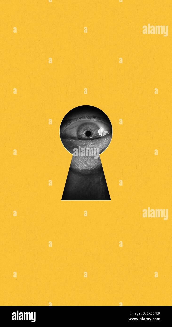 Wide open male eye looking into keyhole on yellow background ...