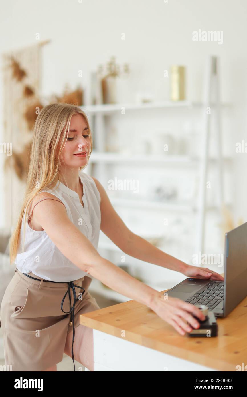 Concentrated gorgeous girl smiling while typing on computer Stock Photo ...