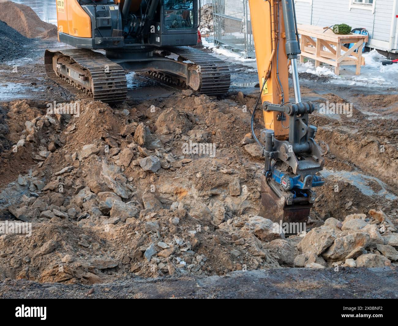 Excavator digging hole on construction site, Oulu Finland Stock Photo ...
