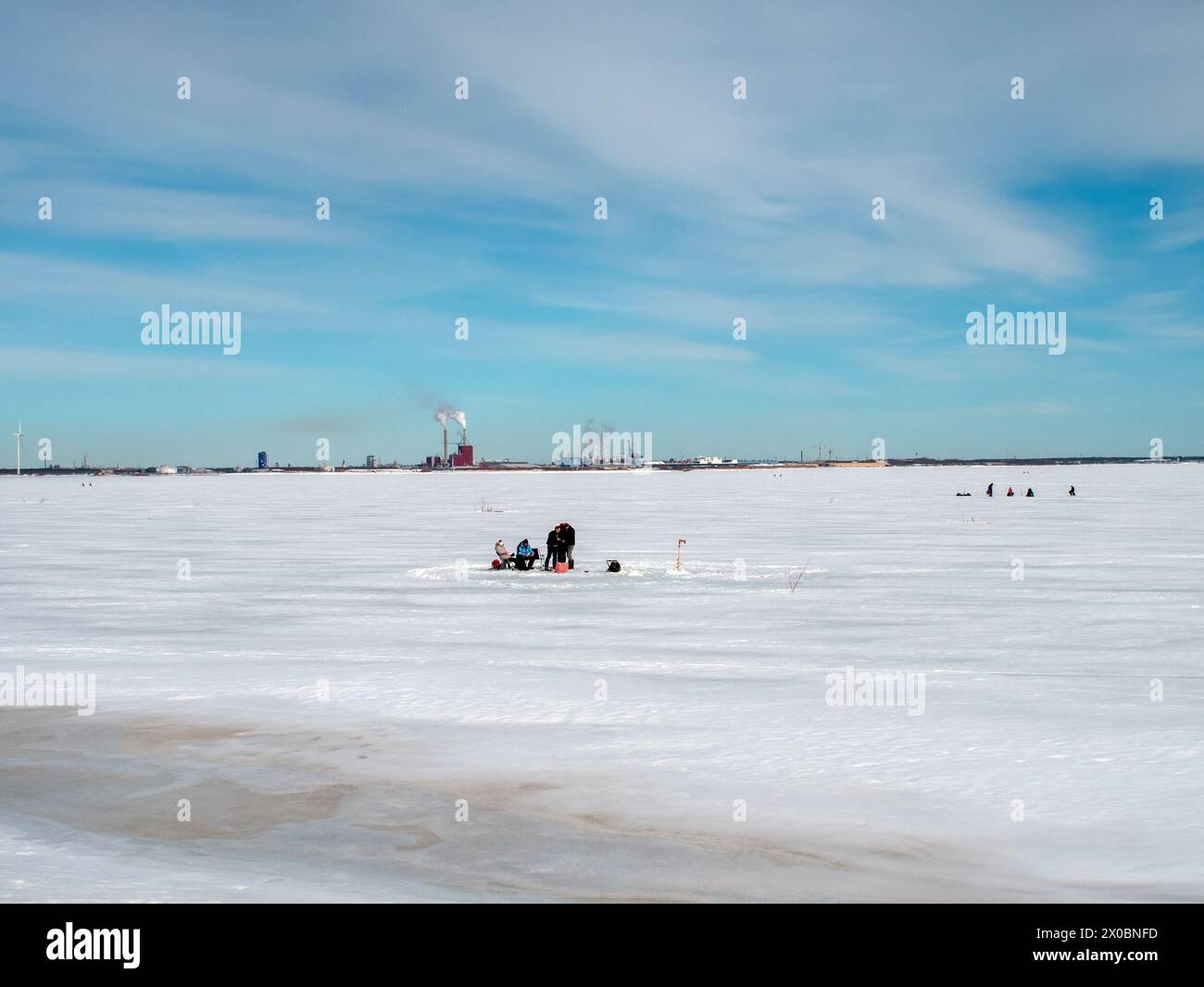 ice fishing on a frozen sea ice in Varjakka, Oulu Finland Stock Photo ...