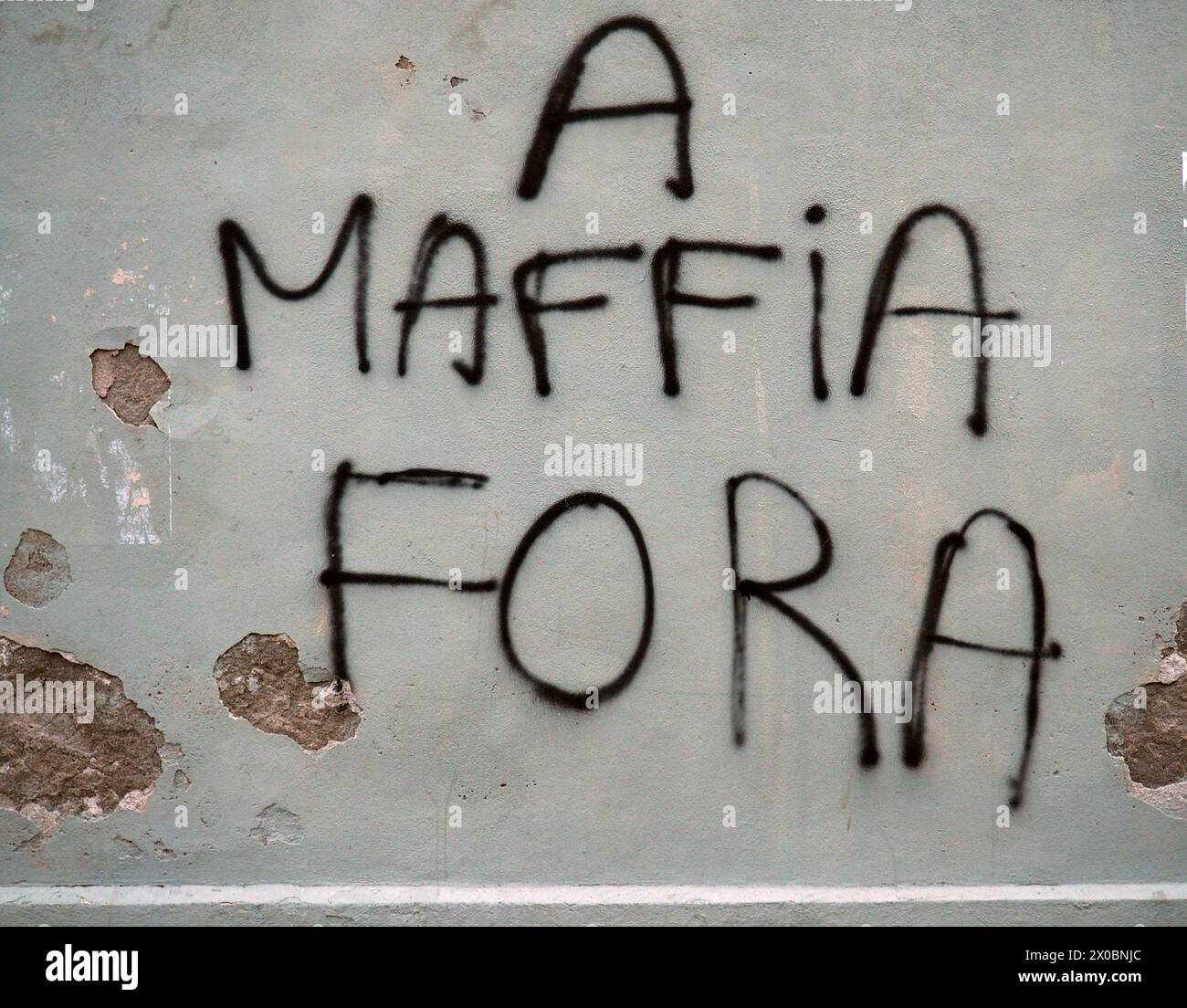Bastia, France. 23rd Feb, 2024. "Mafia out!" is written in Corsican on the wall of a house in ...