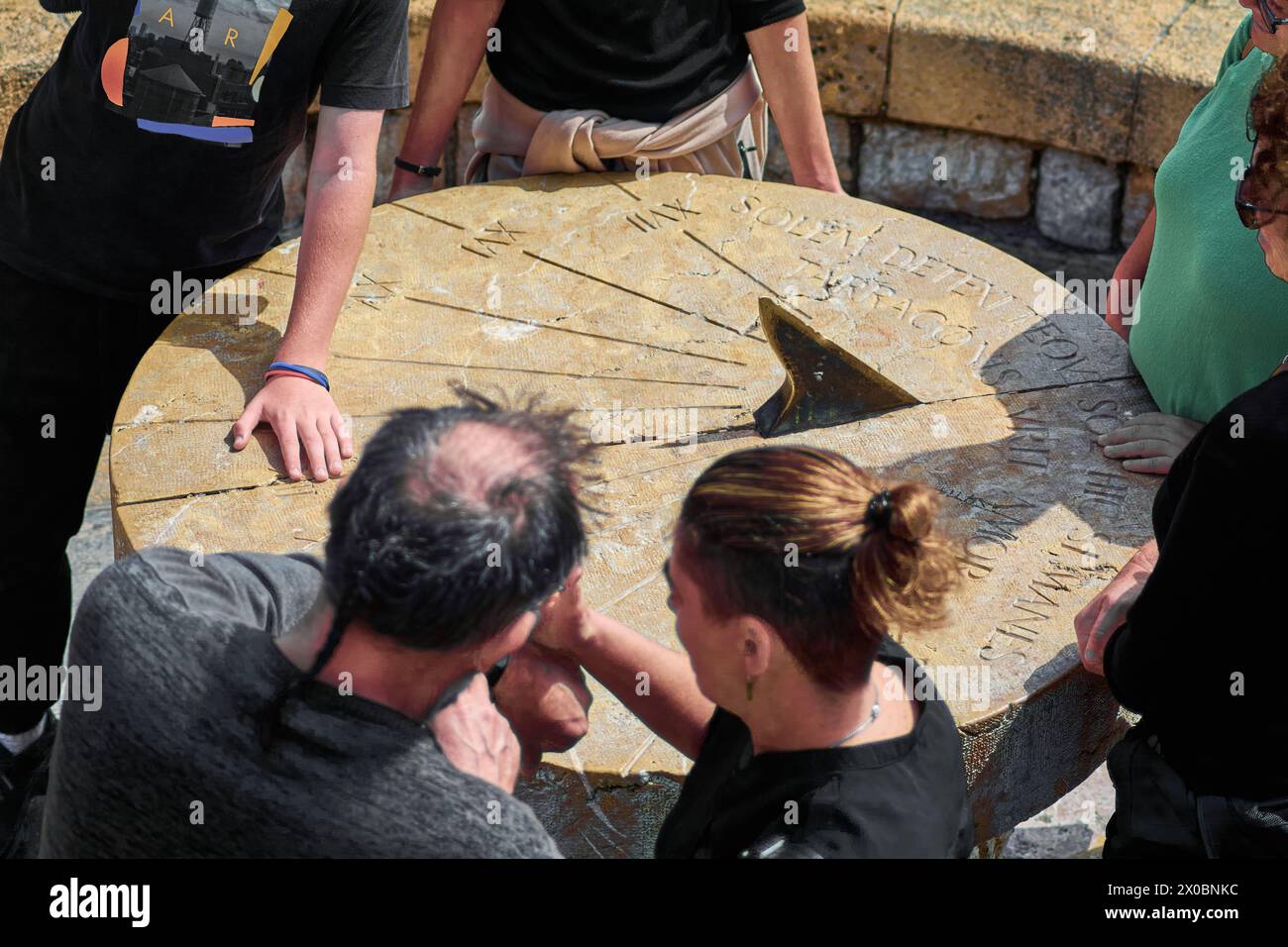 Tarragona, Spain - April 11, 2024: A group of people gather around an ...