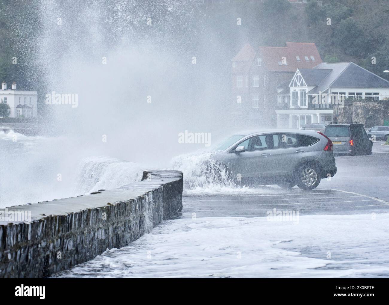 Large Storm Waves Crash Into Harbour Defences And Parked Cars At