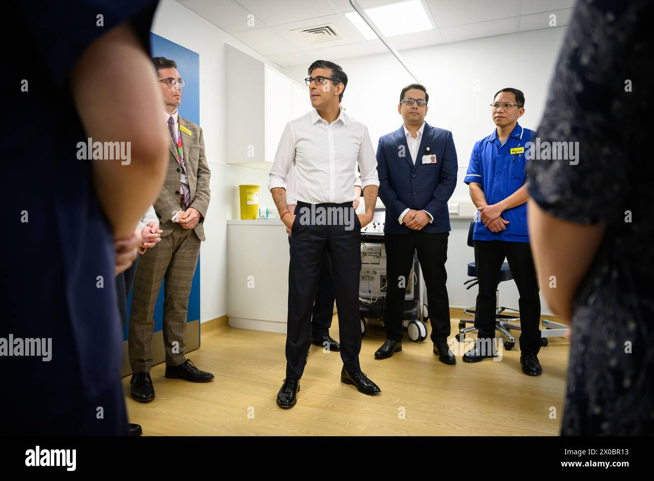 Prime Minister Rishi Sunak speaks with medical staff during a visit to ...