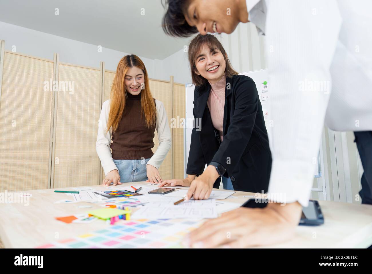 team of UI UX web designer are working together to develop mobile ...