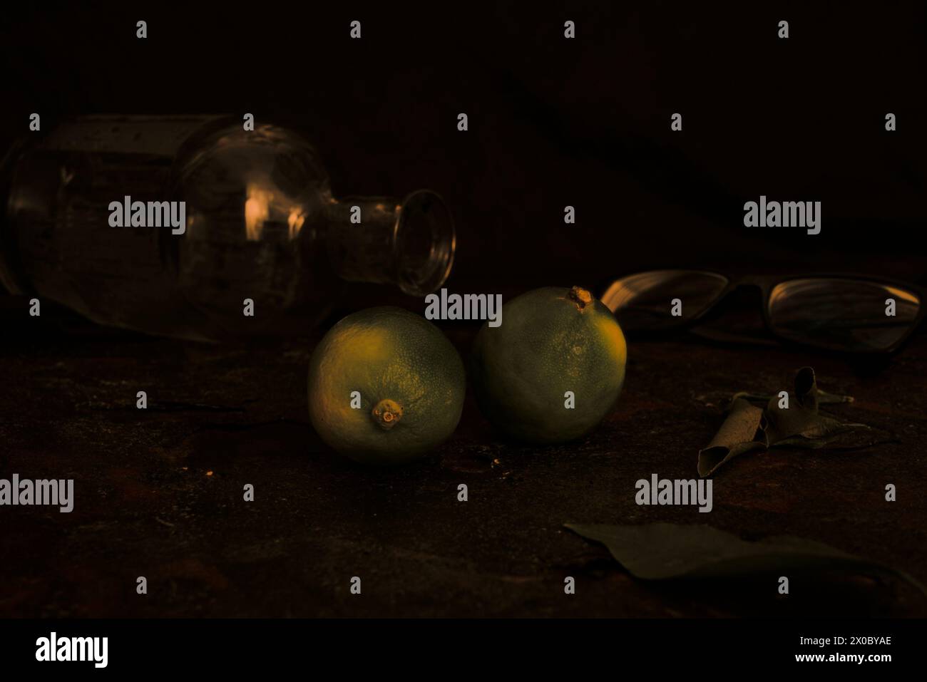 still life with limes and dark background Stock Photo - Alamy