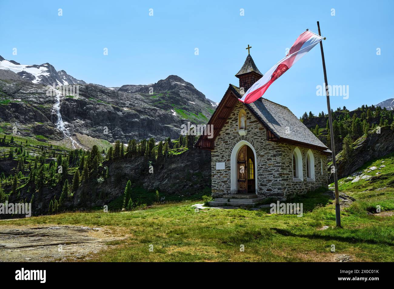 Alpine panorama with a little church during the summer in the South ...