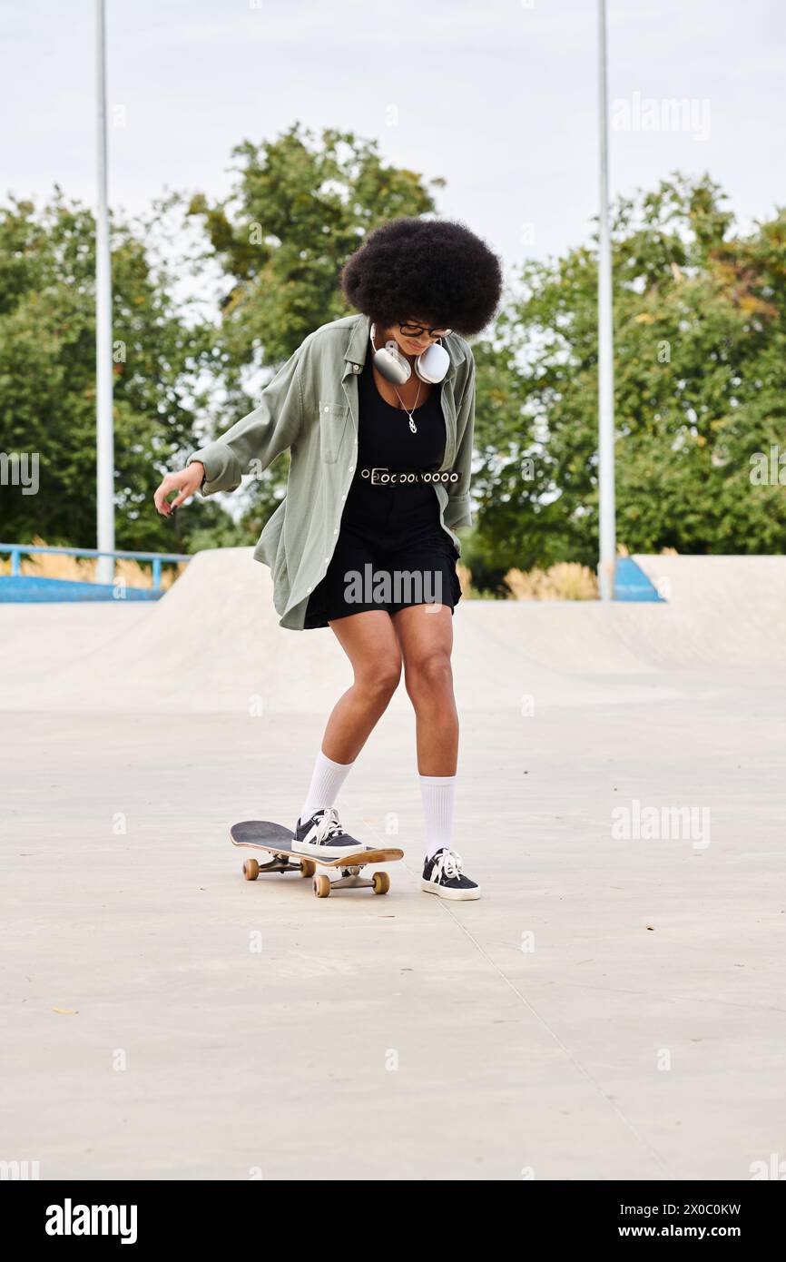 A young African American woman with curly hair showcases her ...